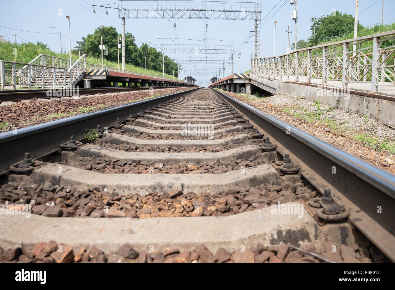 Railway track at the railway station. Cross ties and rails close up ...