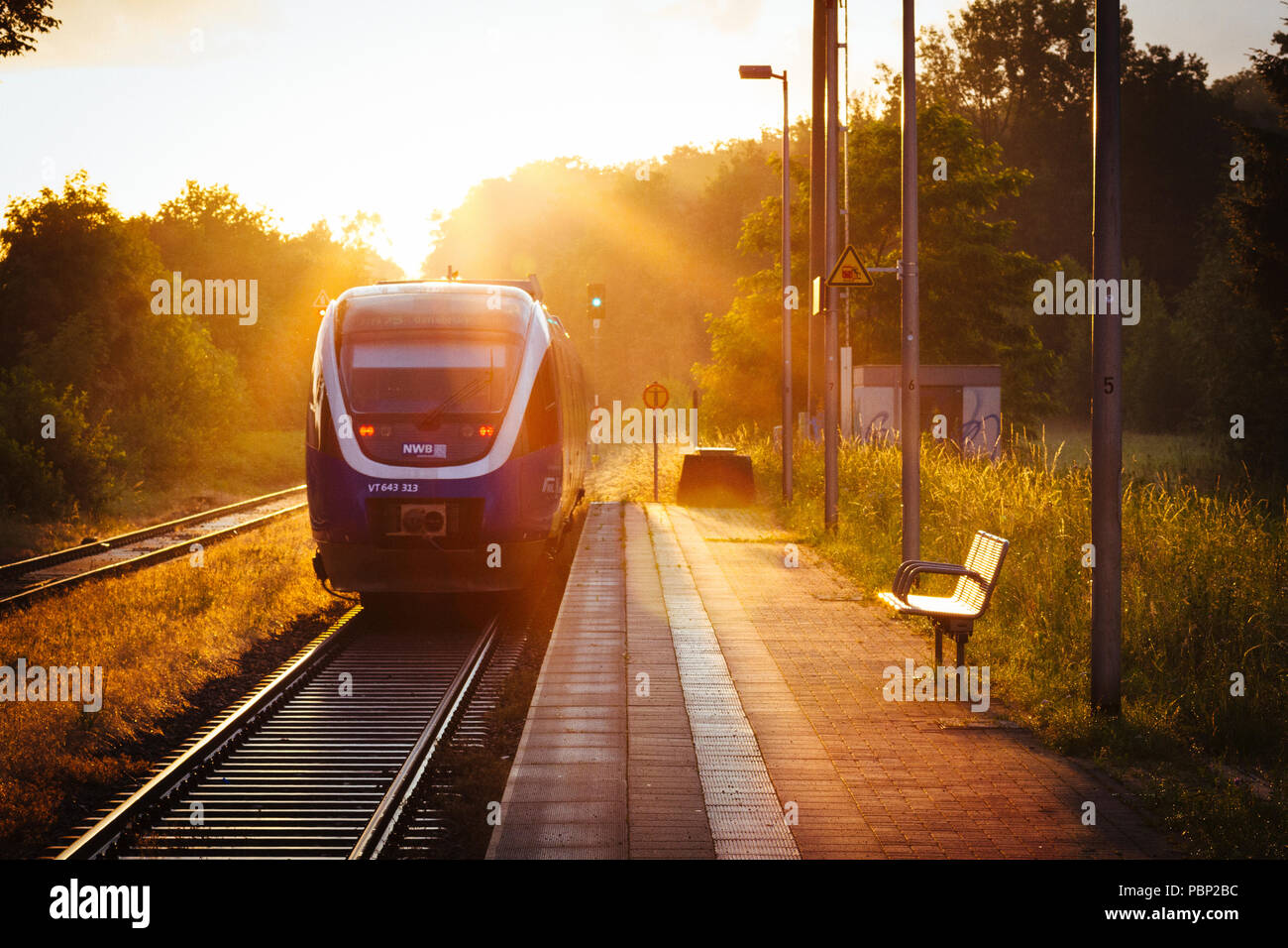 A local train leaving the small station of Quelle, Germany, in the ...