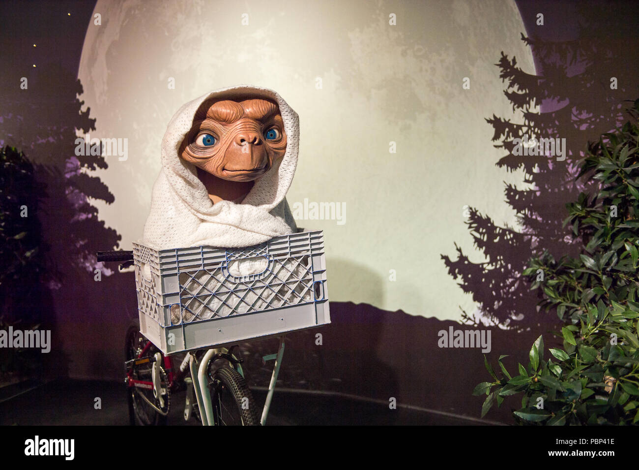 AMSTERDAM, NETHERLANDS - JUN 1, 2015: Alien ET on a bycicle, Madame ...