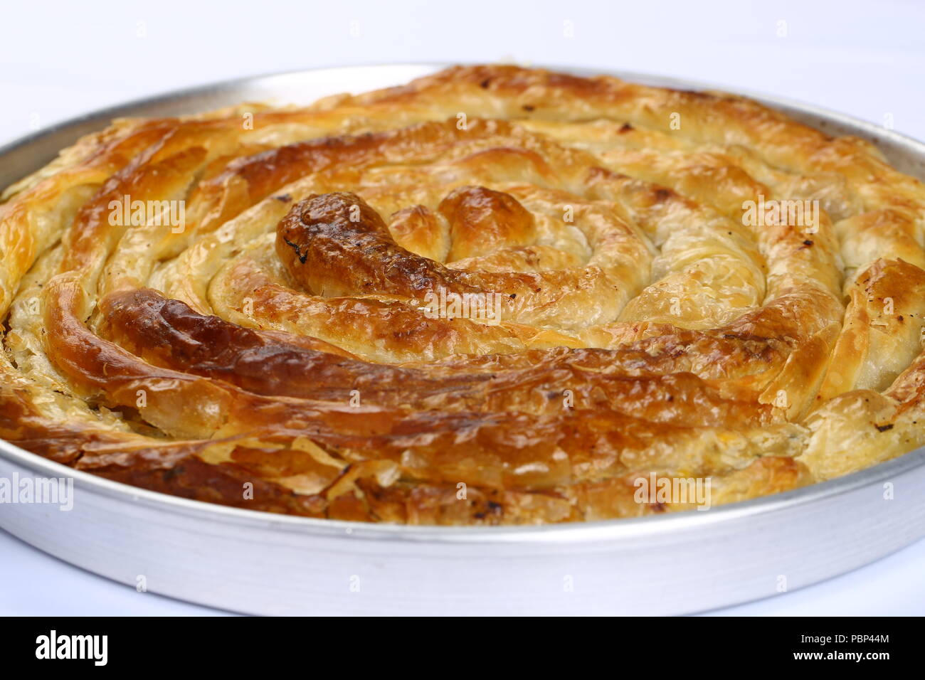 Round Borek in tray / Greek Cheese pie Stock Photo - Alamy