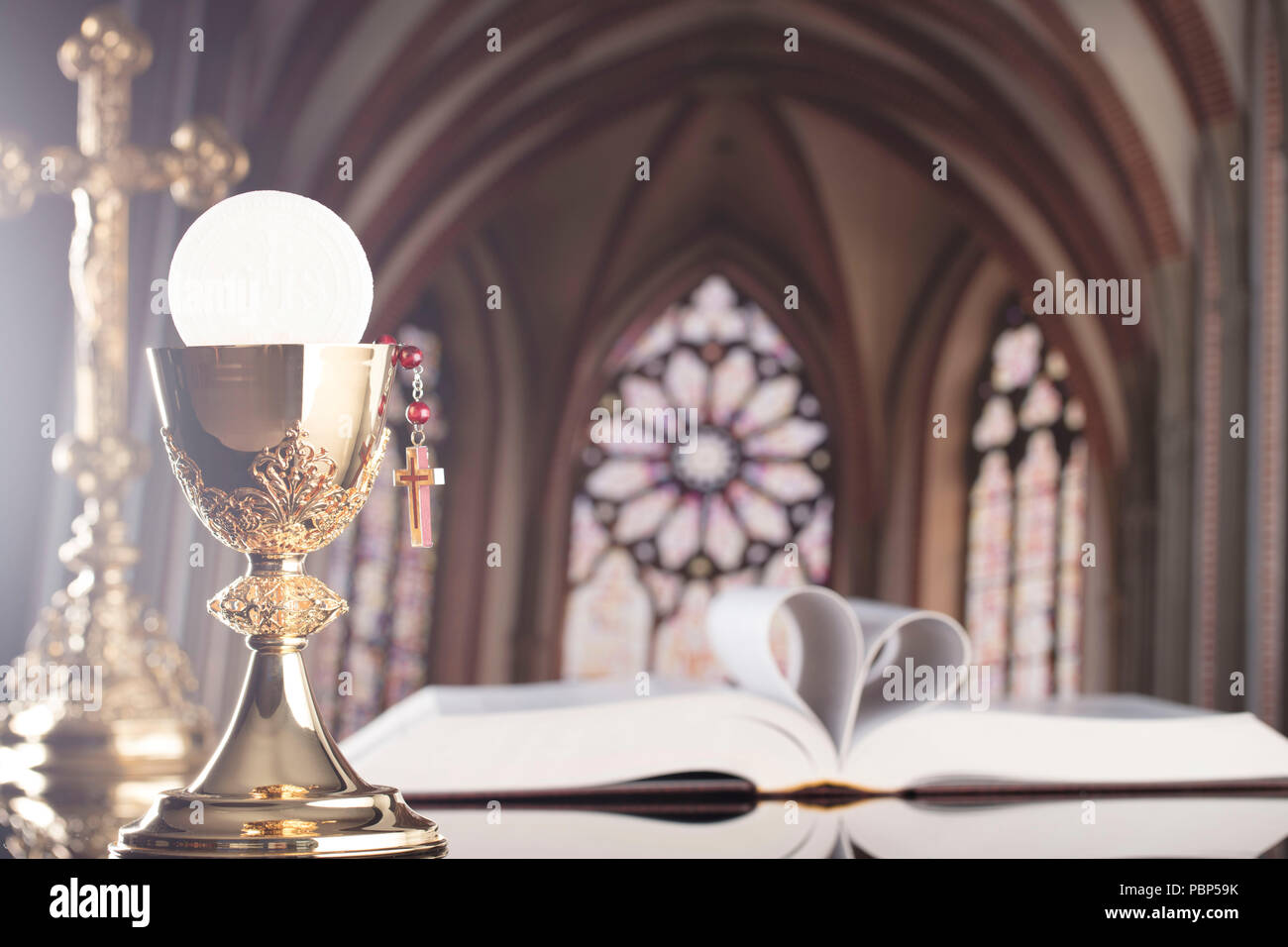 Roman Catholic Church theme. The Cross, Holy Bible, rosary and golden ...