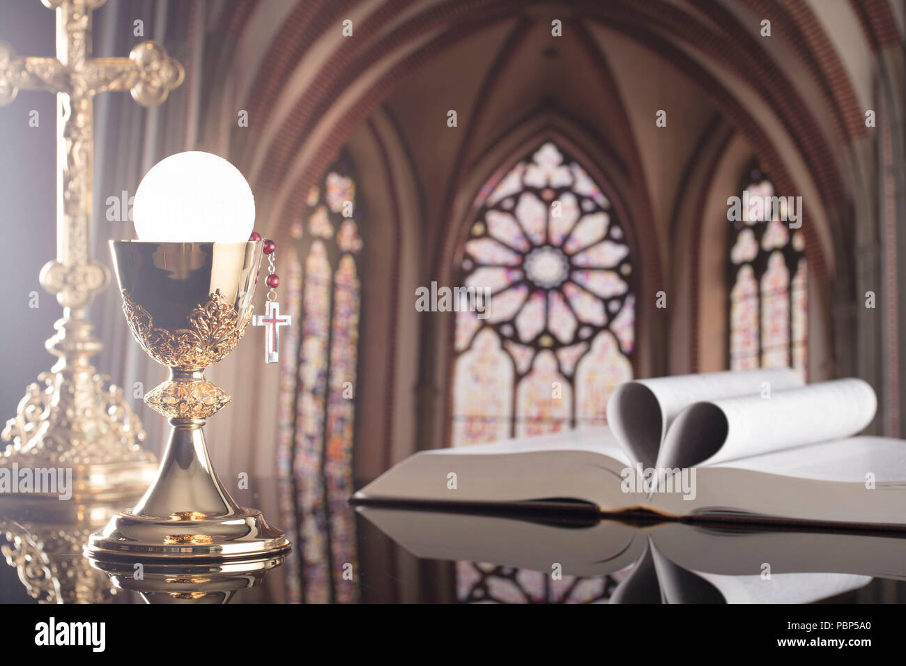 Roman Catholic Church theme. The Cross, Holy Bible, rosary and golden ...