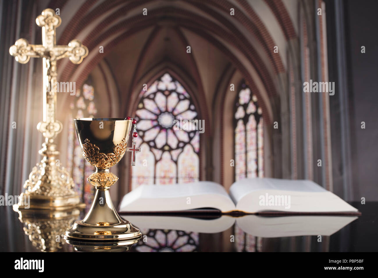 Roman Catholic Church theme. The Cross, Holy Bible, rosary and golden ...