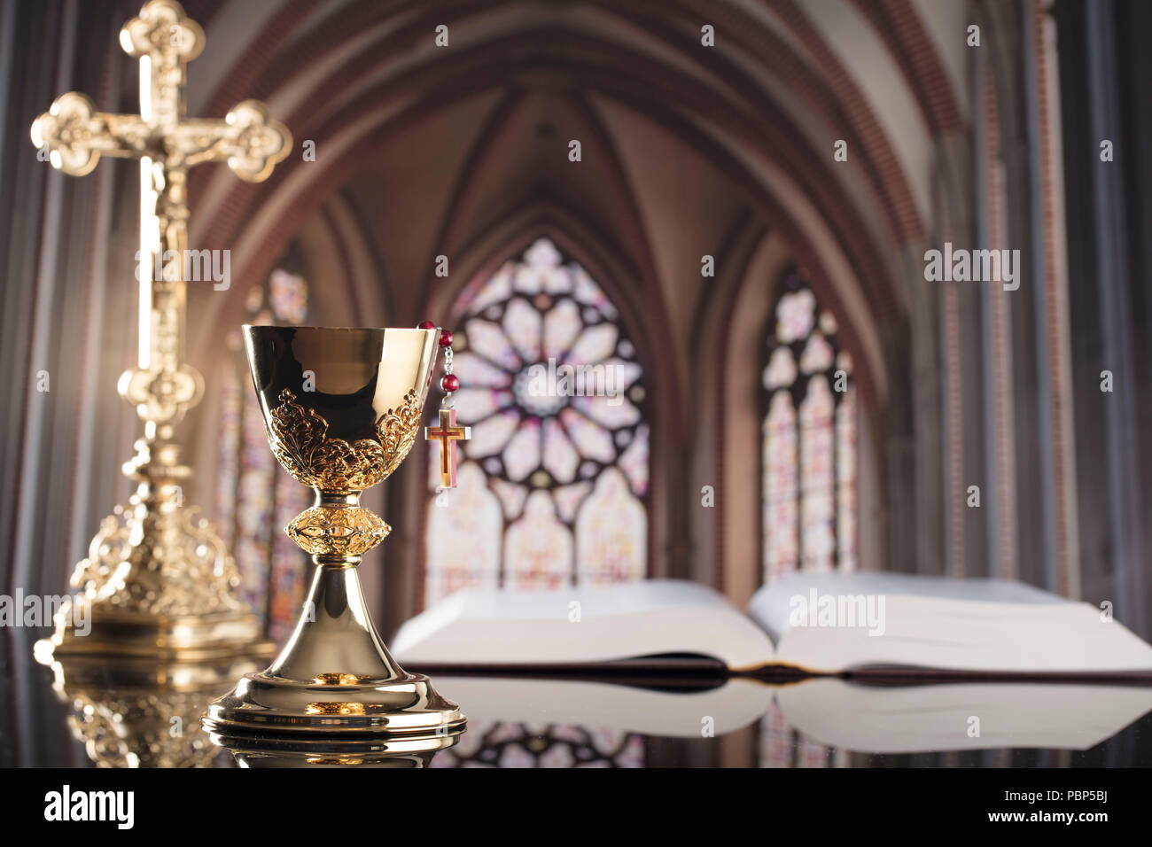 Roman Catholic Church theme. The Cross, Holy Bible, rosary and golden ...