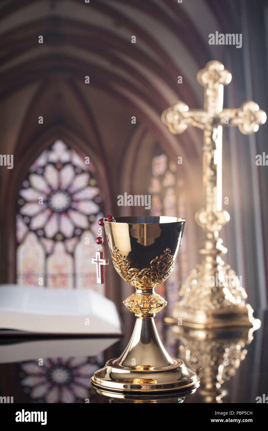 Roman Catholic Church theme. The Cross, Holy Bible, rosary and golden ...