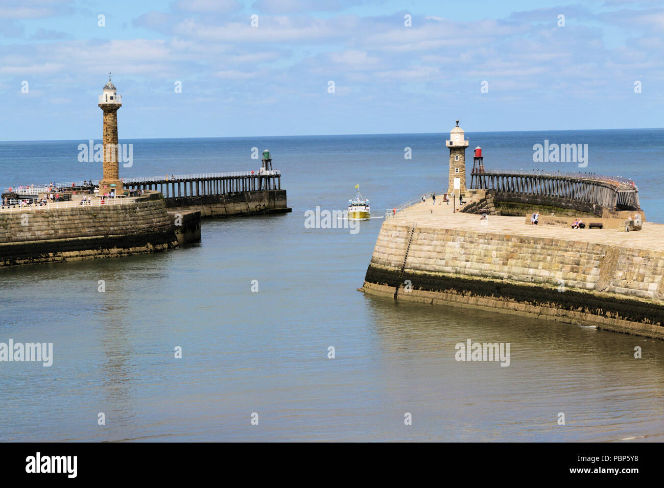 Whitby harbour entrance showing west (left) and east piers Stock Photo ...