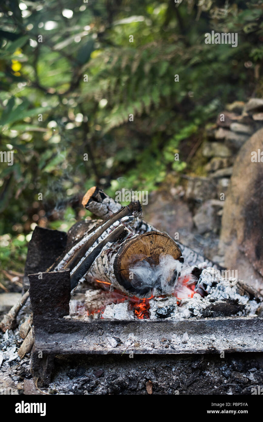 Smoking embers at outdoor campfire with hot coals Stock Photo - Alamy