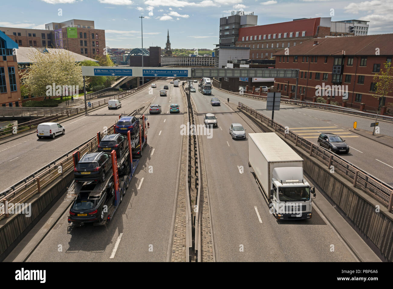 Central motorway, Newcastle with cars, trucks, and car transporter ...
