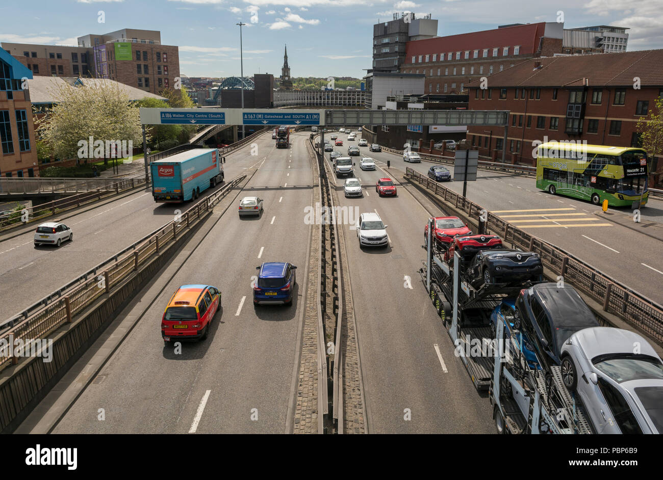 Central motorway, Newcastle with cars, trucks, and car transporter ...