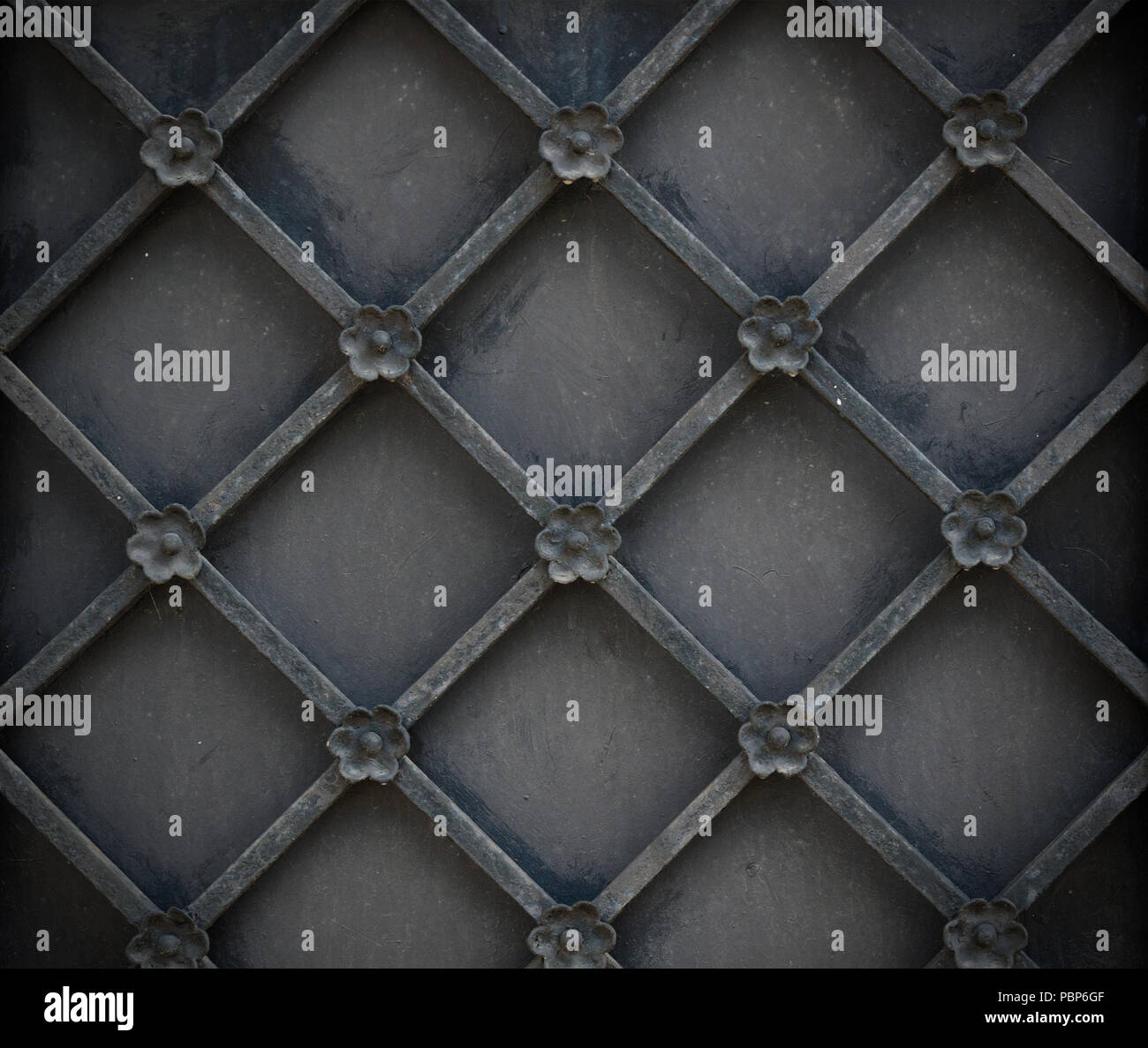 Metal church door texture. Black solid background with flowers pattern ...