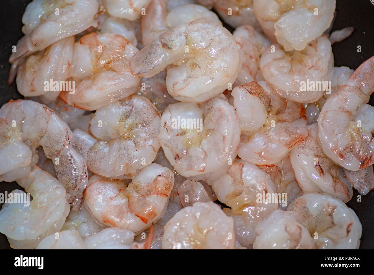 Fresh washed shrimp just rinsed and prepped to be cooked.on the kitchen ...