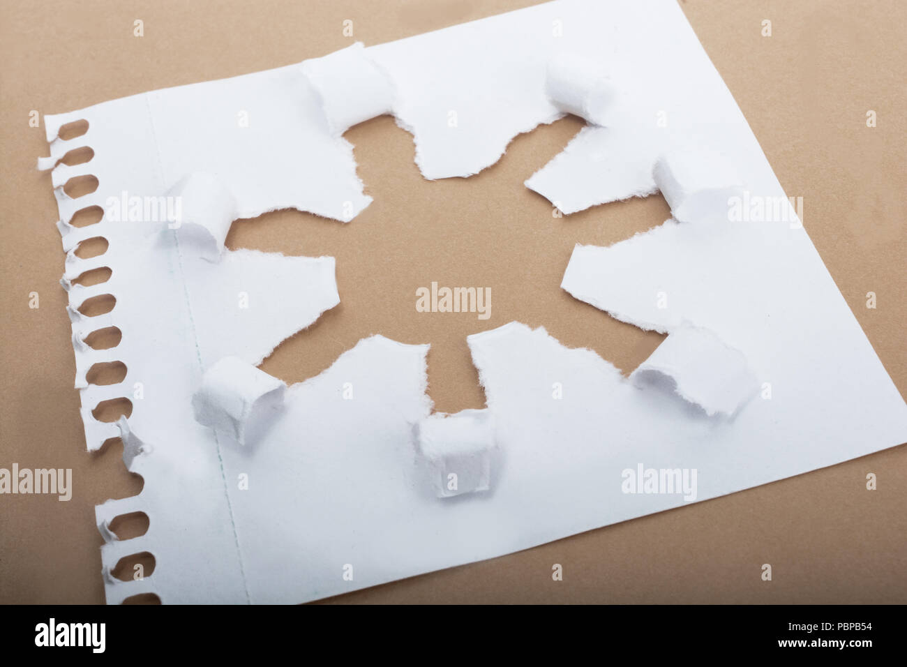 Sun shape made through torn paper in white background Stock Photo - Alamy