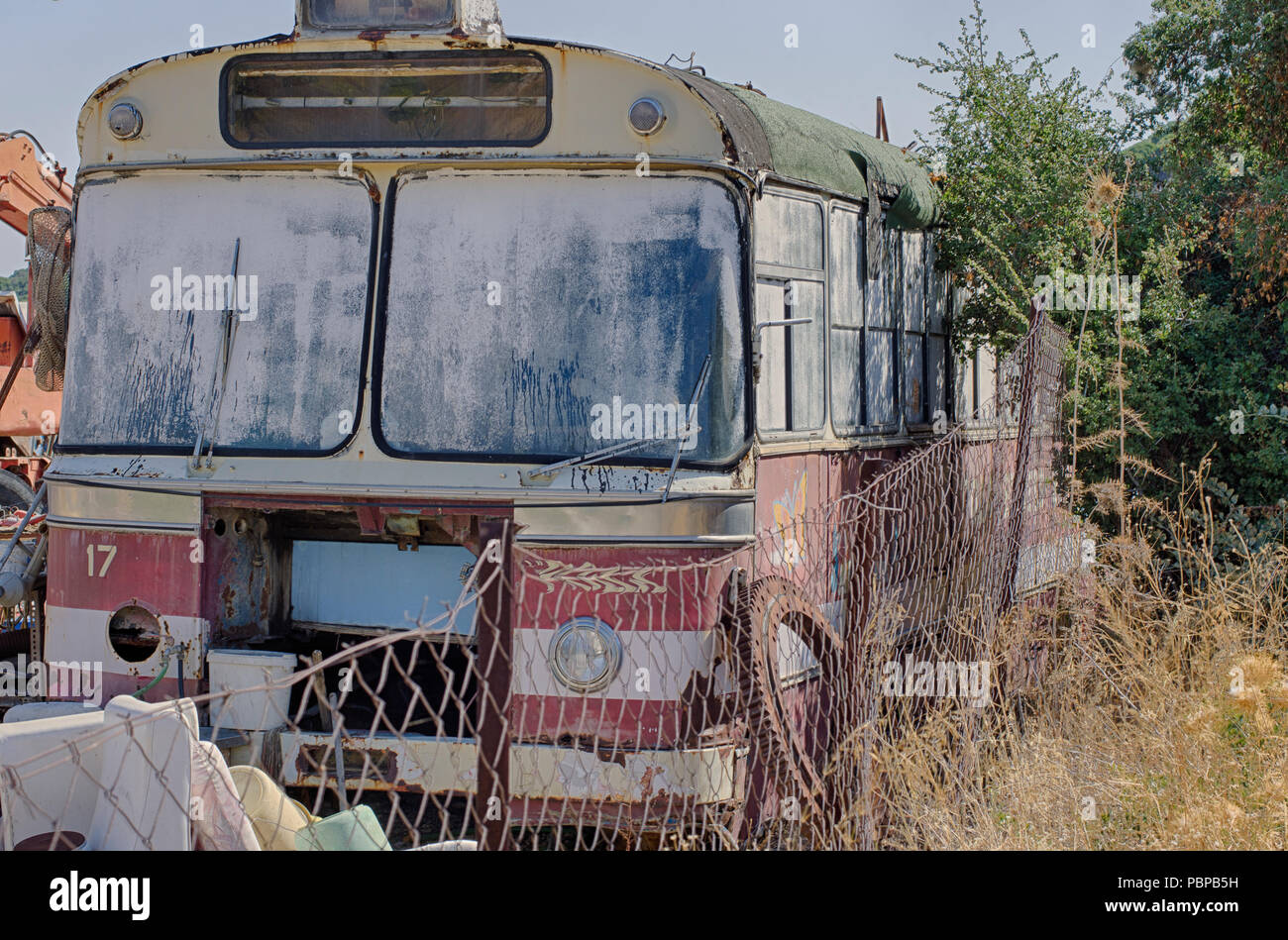 Old vintage regular bus with a rusty grid on barrier on the island ...