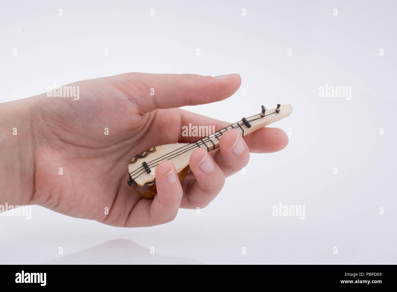 Hand holding turkish musical instrument saz on a white background Stock ...