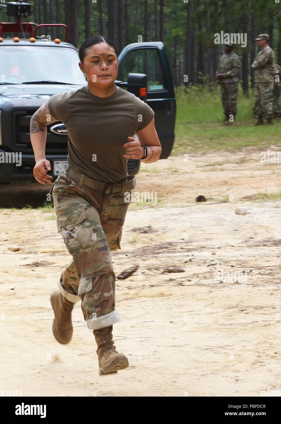 Spc. Diane Hoang from the U.S. Army Training Center, finishes the first ...