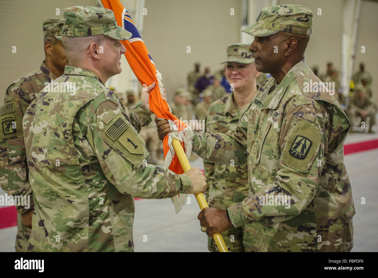 Brig. Gen. John H. Phillips Receives the unit flag from Command Sgt ...