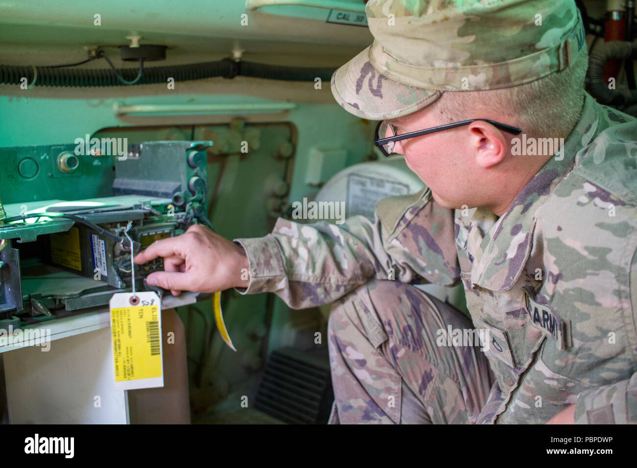 U.S. Army Pfc. Tyler Malone, a radio/communications security repairer ...