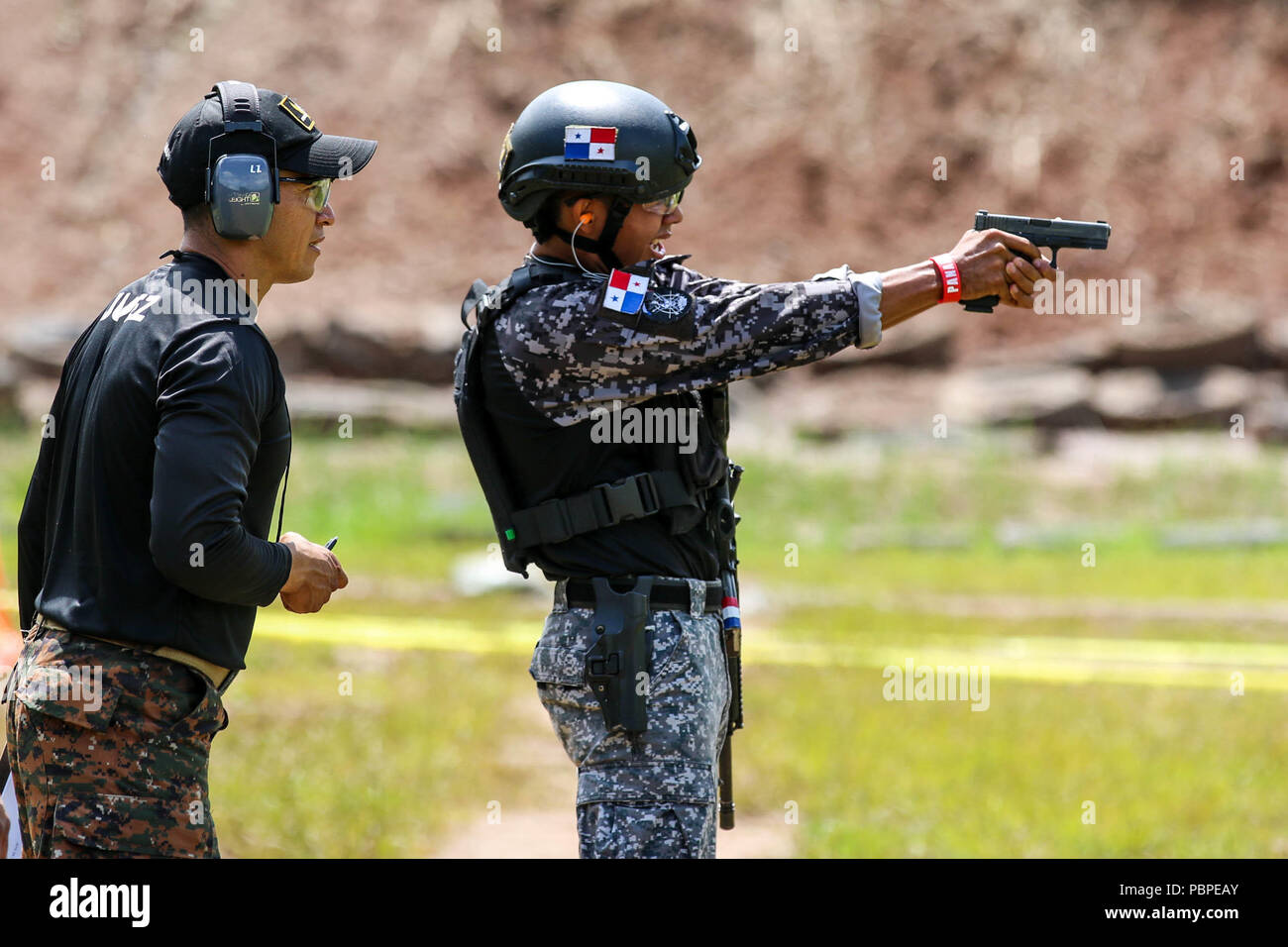 A shooter from team Panama team aims at his target in the assault event ...
