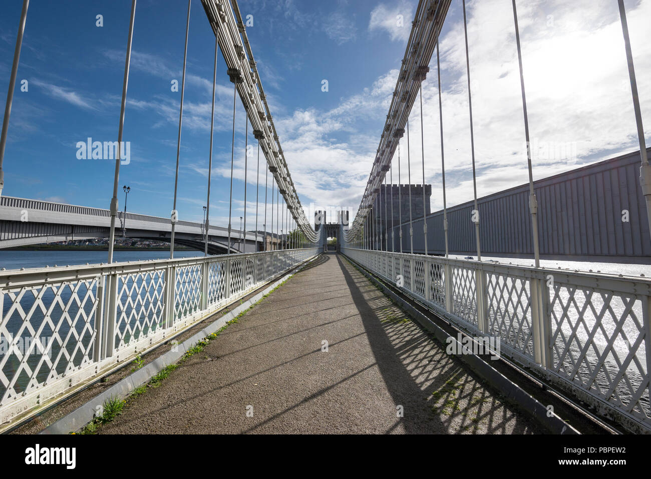 The famous suspension bridge over the river Conwy, North Wales, UK ...