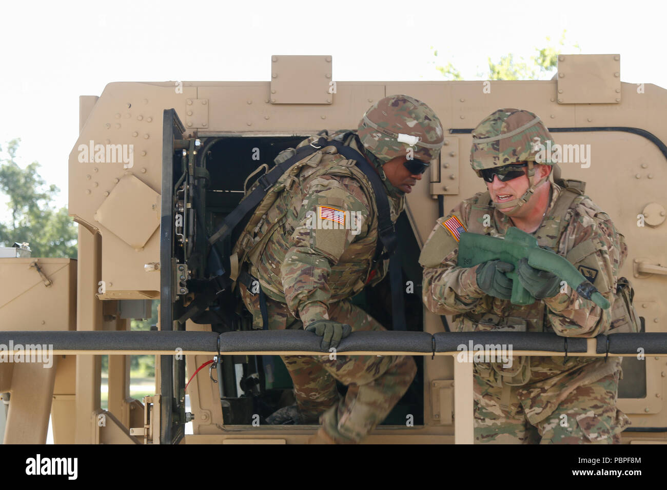 1st Lt. Terence Phillips of HHC 201st RSG exits the cabin of a Humvee ...