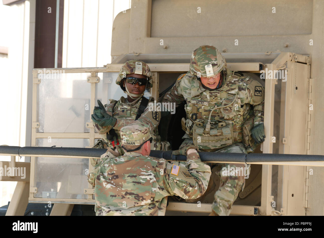 Warrant Officer Christopher Gatny of HHC 201st RSG exits the cabin of a ...