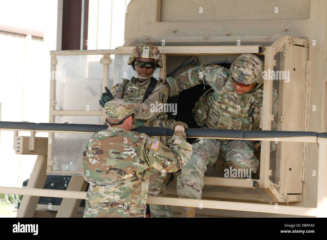 Sgt. 1st Class Jason Schiller of HHC 201st RSG exits the cabin of a ...