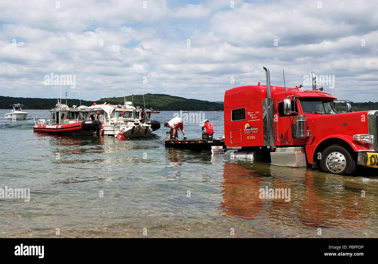 Stretch Duck 7 is loaded onto a flatbed trailer to be transported to a ...