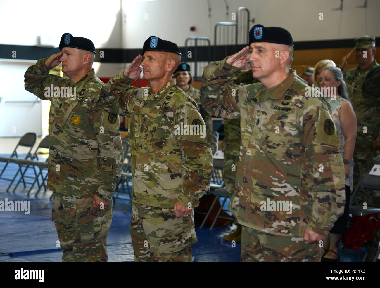 The reviewing party salutes (from left to right Command Sgt. Maj ...