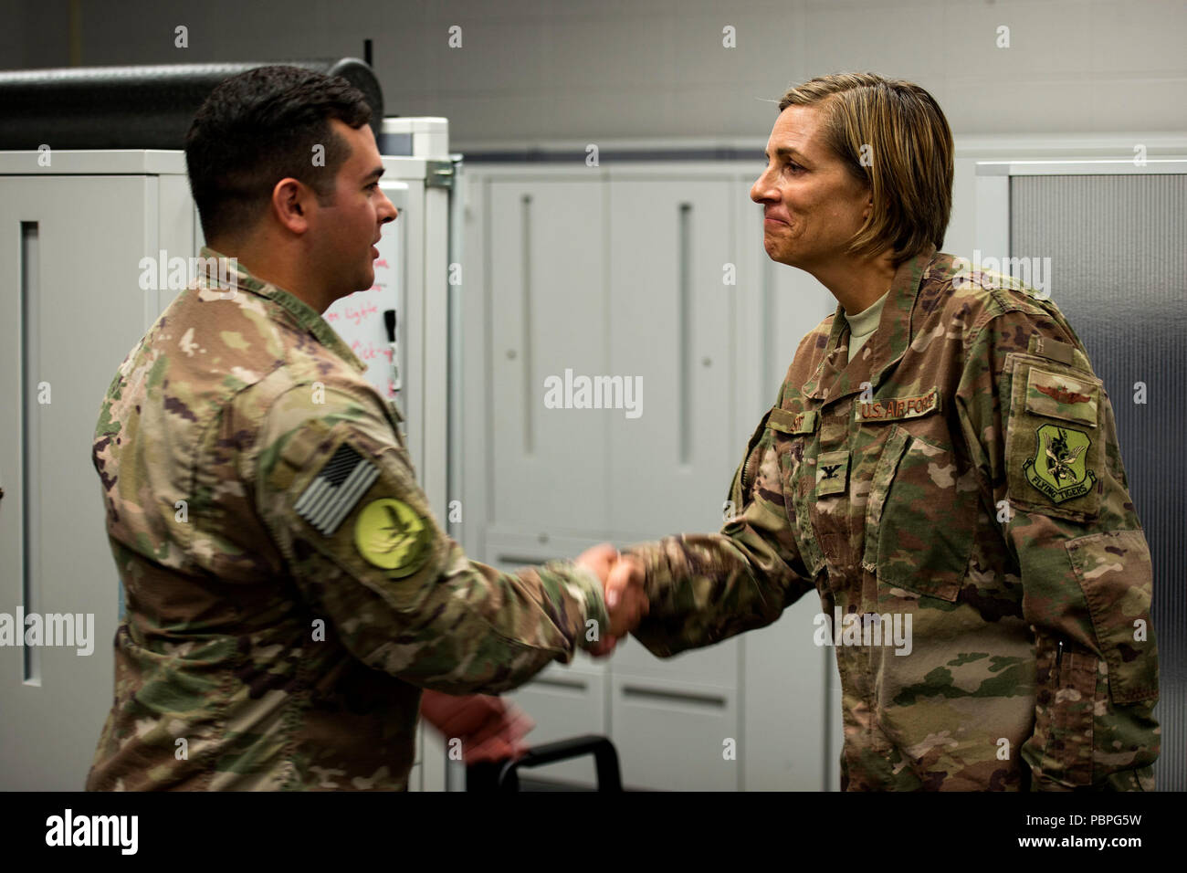 Col. Jennifer Short, right, 23d Wing commander, coins Staff Sgt ...