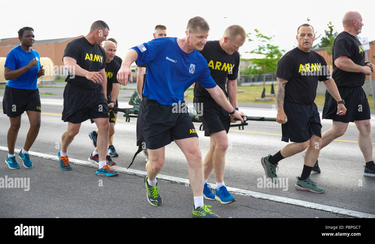 10th Mountain Division's Mountain 7, CSM Jason Roark (center) hands off ...