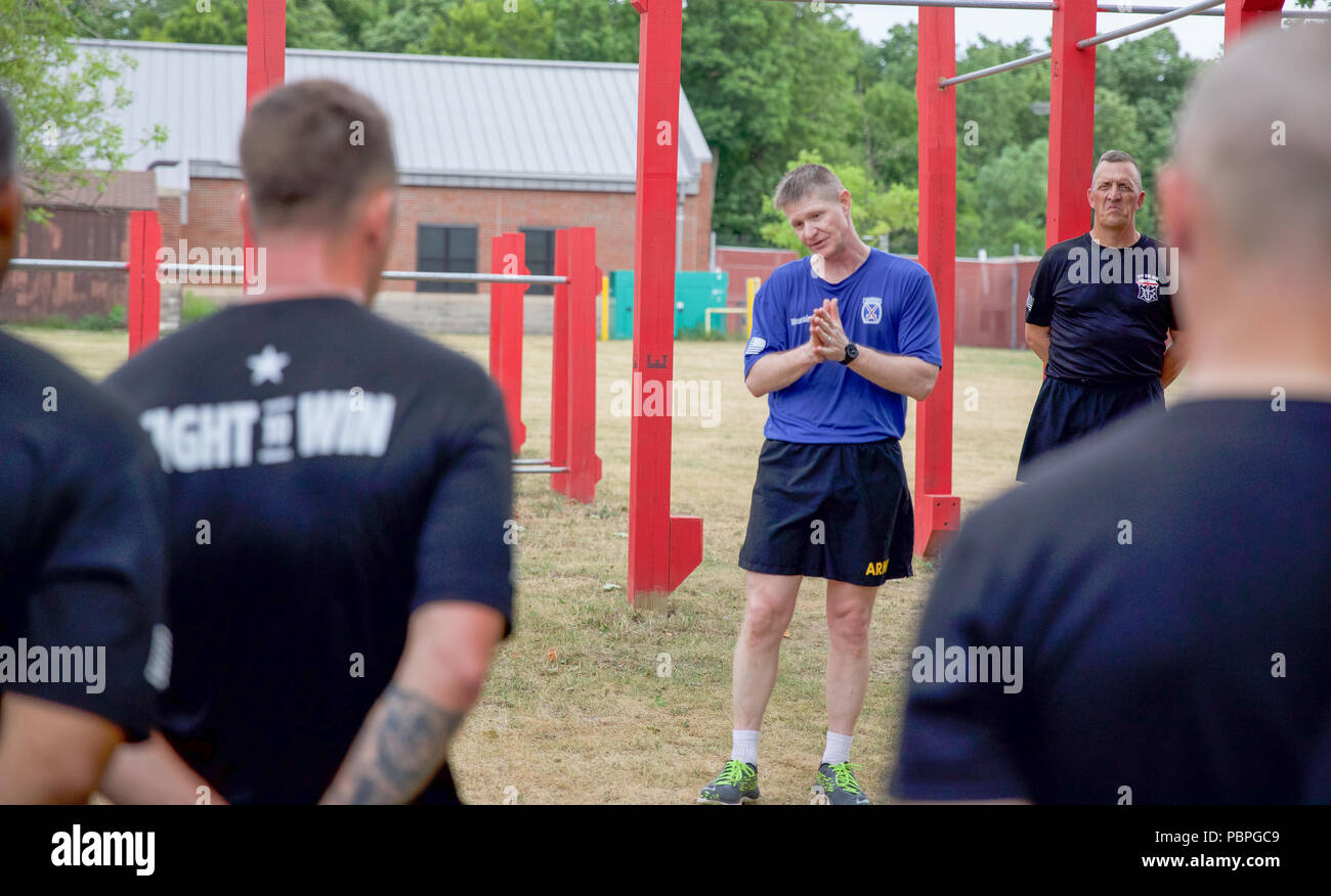 10th Mountain Division's Mountain 7, CSM Jason Roark (center), speaks ...