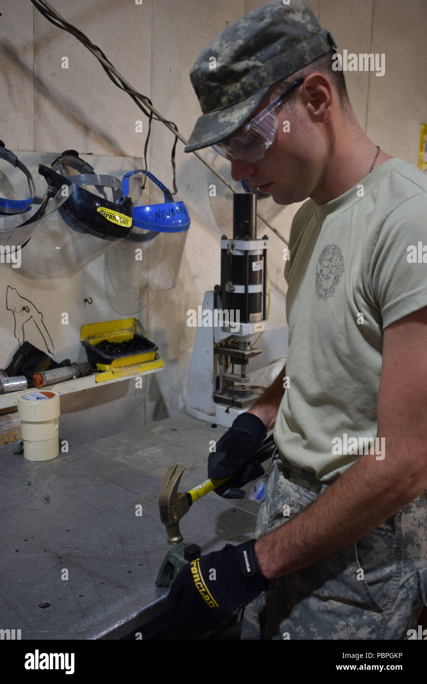 Soldiers from the 411th Ordnance Battalion disassemble M18A1 Claymore ...