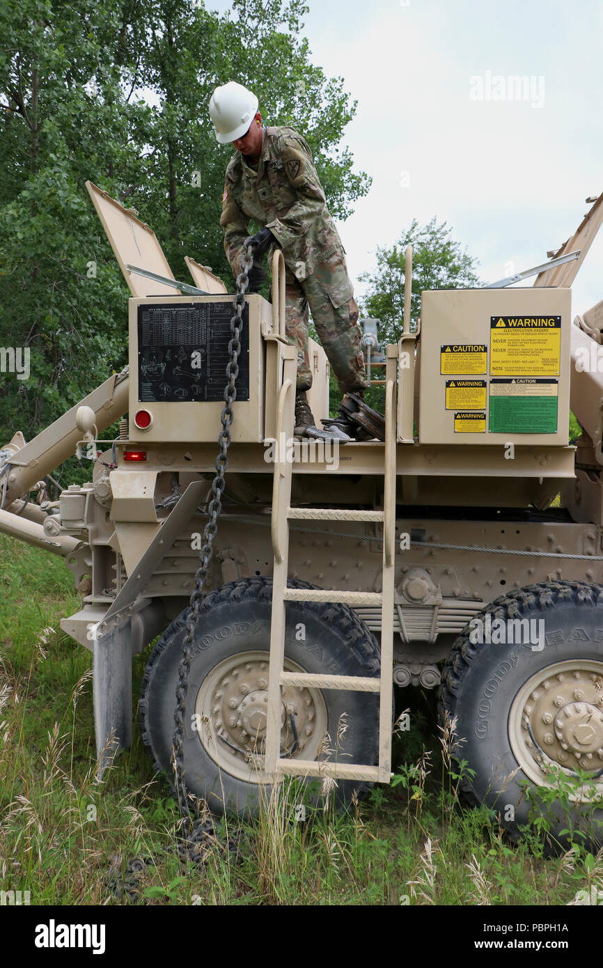 Spc. Robert Owens, a wheeled vehicle mechanic with the 170th Military ...