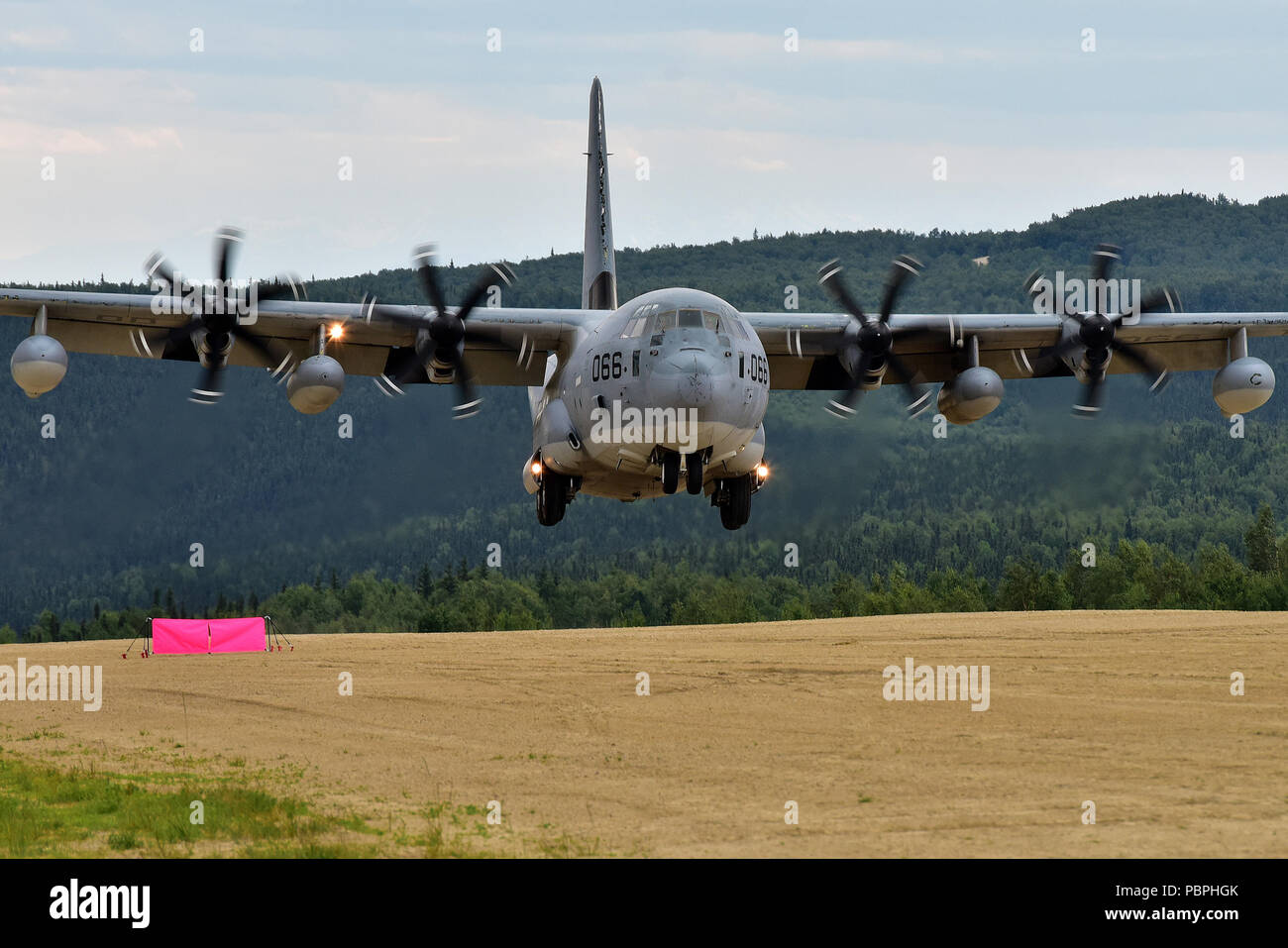 A U.S. Marine Corps C-130 Hercules lands at the Firebird Assault ...