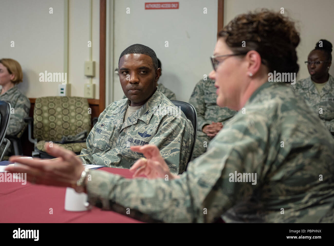 Col. Otis C. Jones, 374th Airlift Wing commander, listens to a mission ...