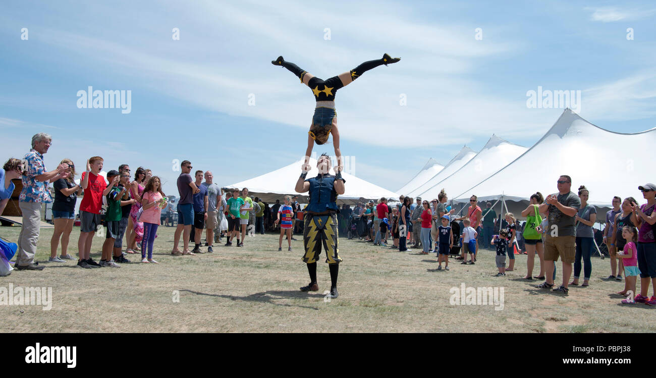 Acrobats with the Colorado Renaissance Festival perform for a crowd at ...