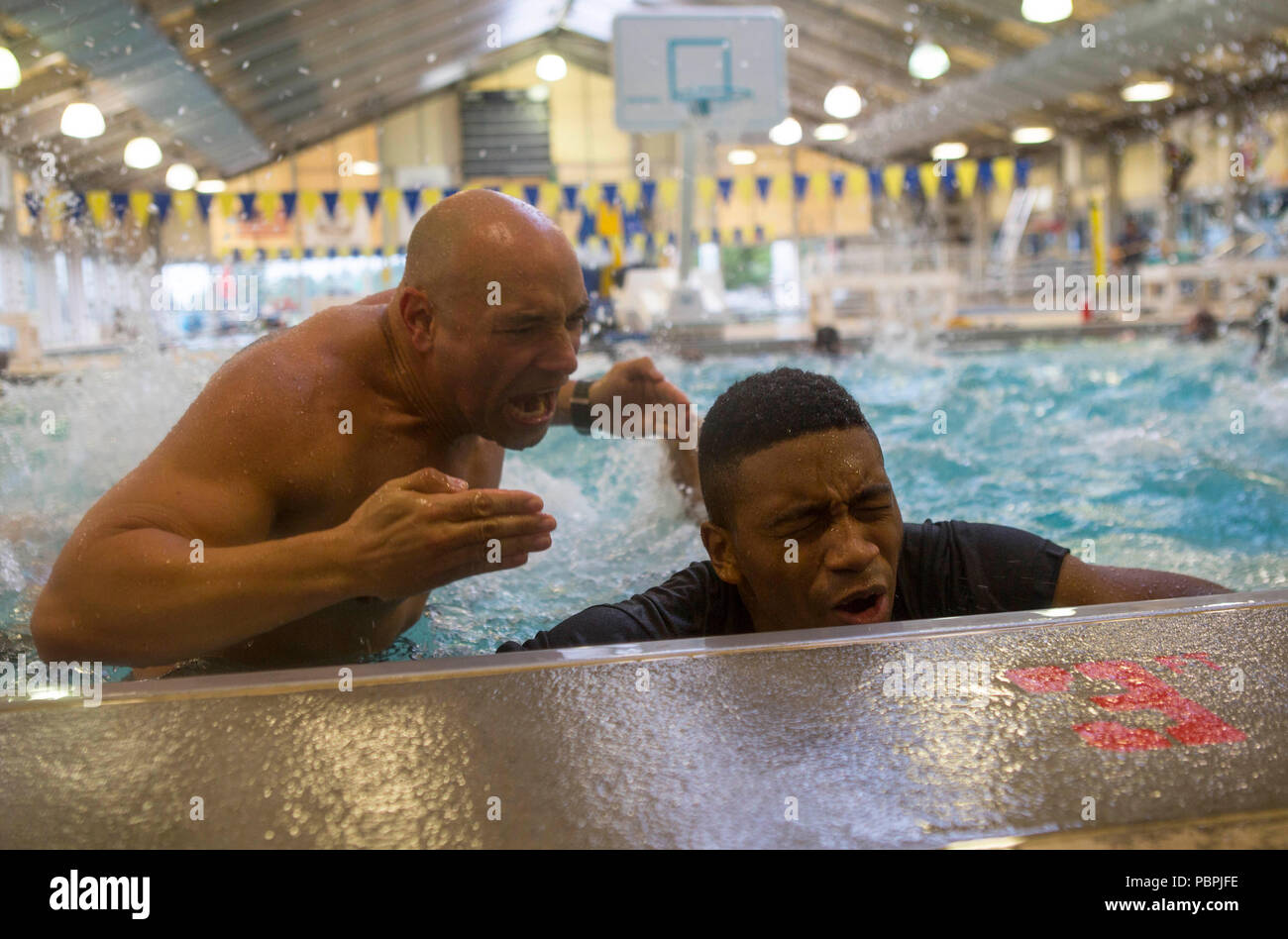 1st Sgt. Peter Sarni III offers encouragement to Spc. Ryan Clarke ...
