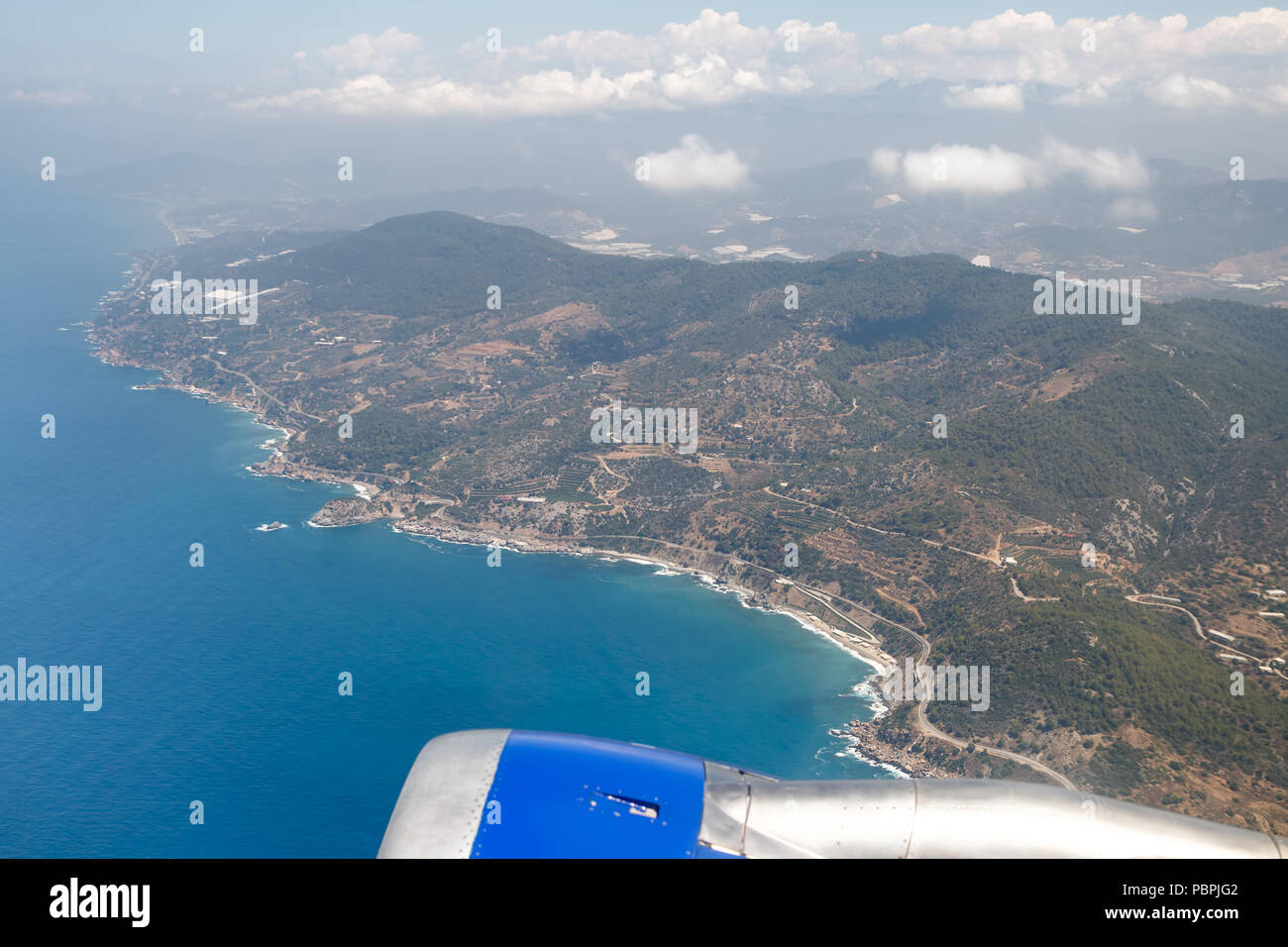 Airplane fly above beautiful coastline hi-res stock photography and ...