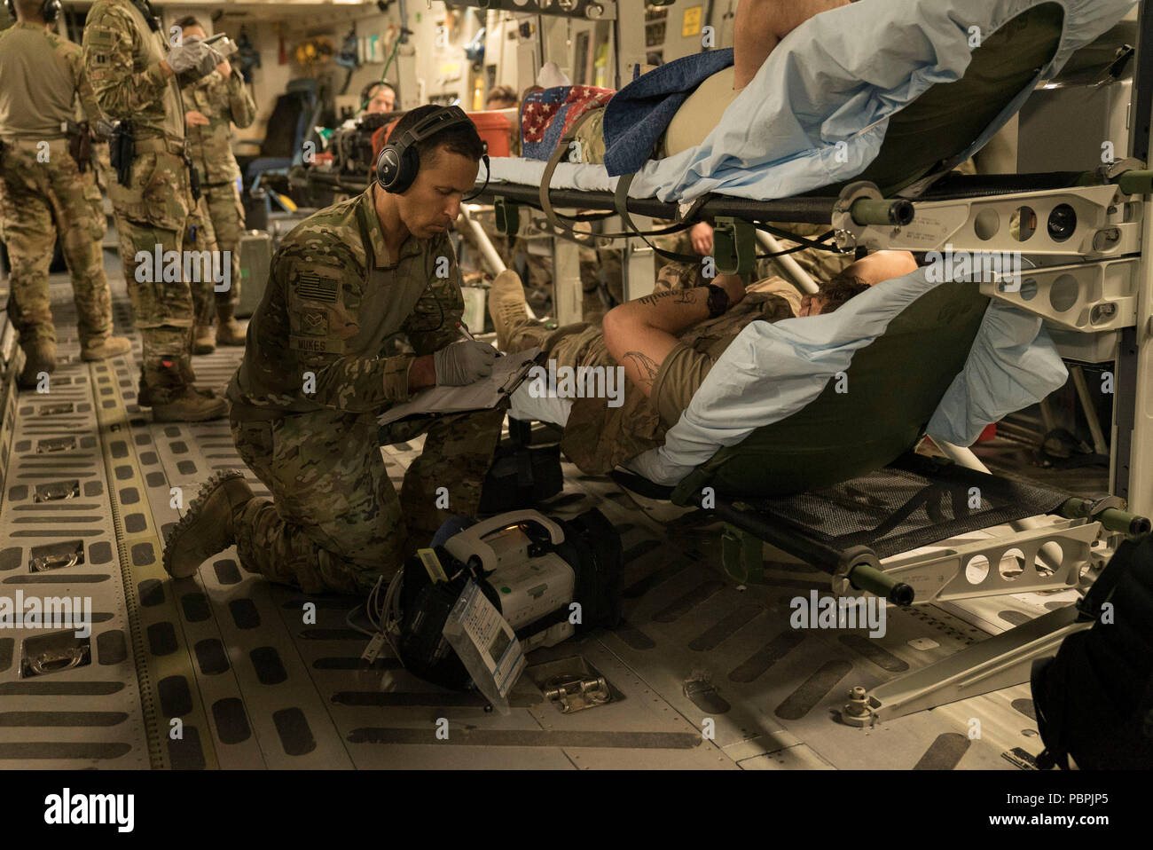 Senior Airman Eric Mukes, flight medic, 455th Expeditionary Aeromedical ...