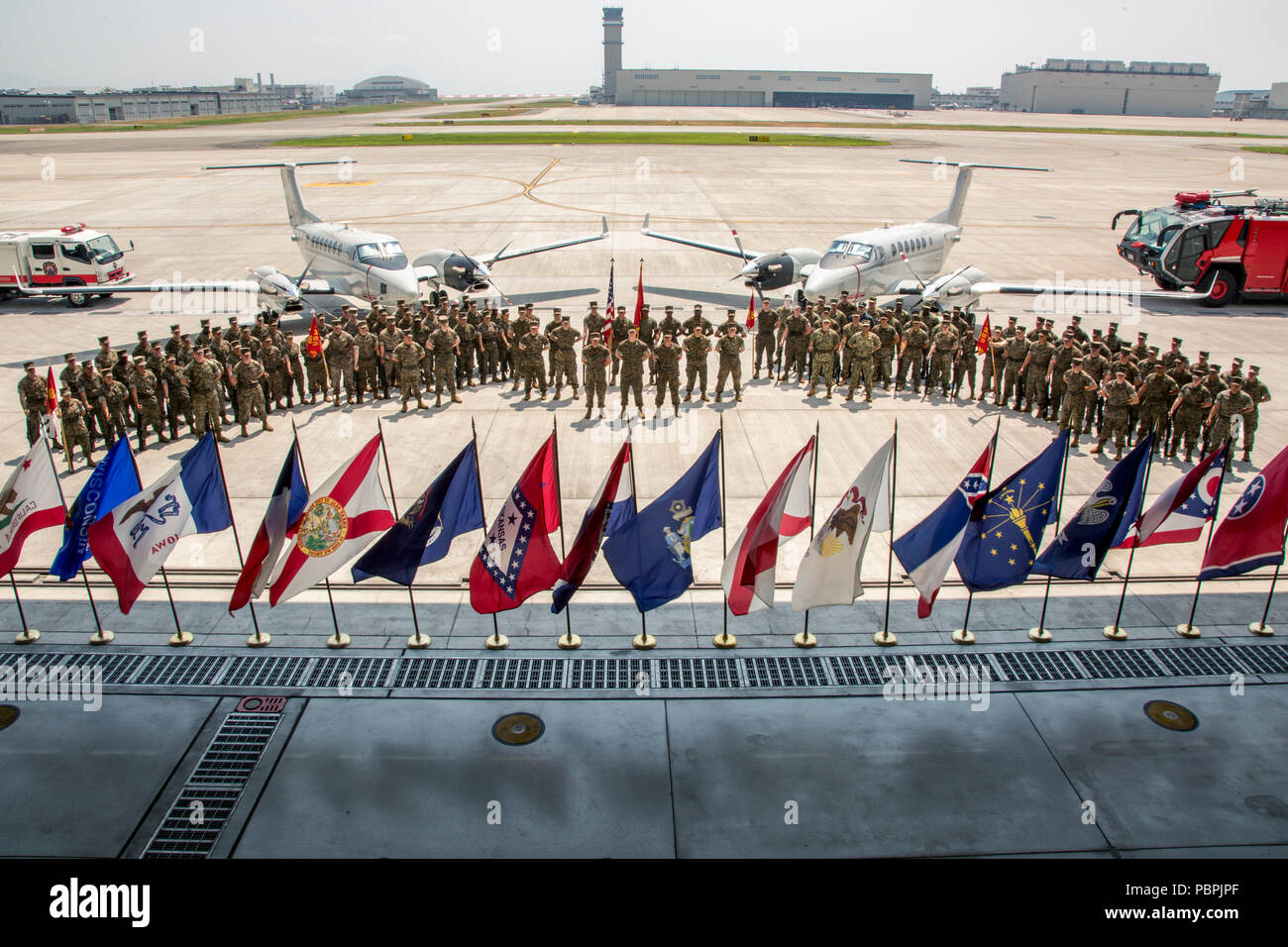 U.S. Marines with Headquarters and Headquarters Squadron (H&HS) gather ...