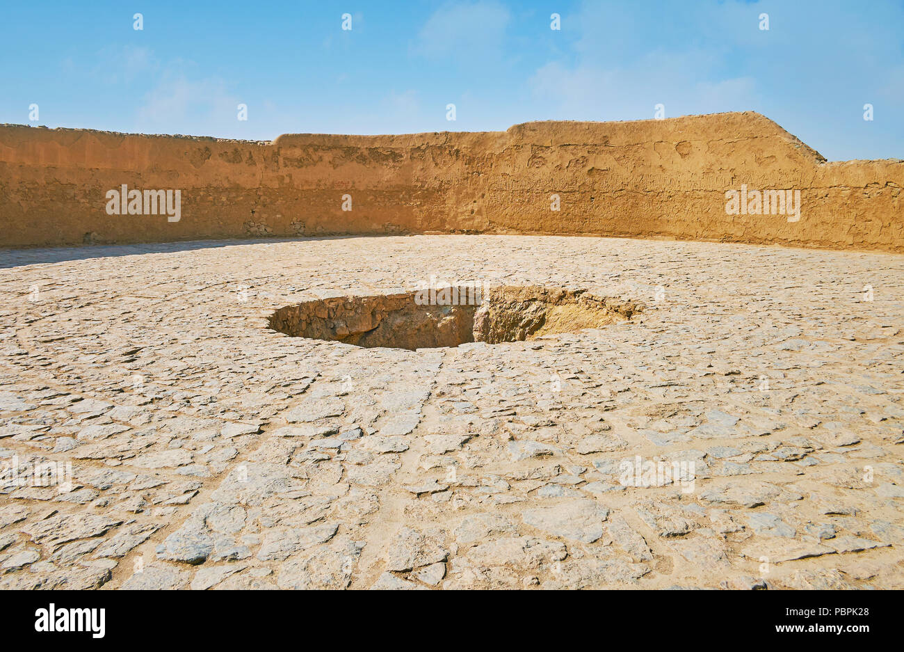 The inner space of Tower of Silence (Dakhma) with ossuary pit in the ...