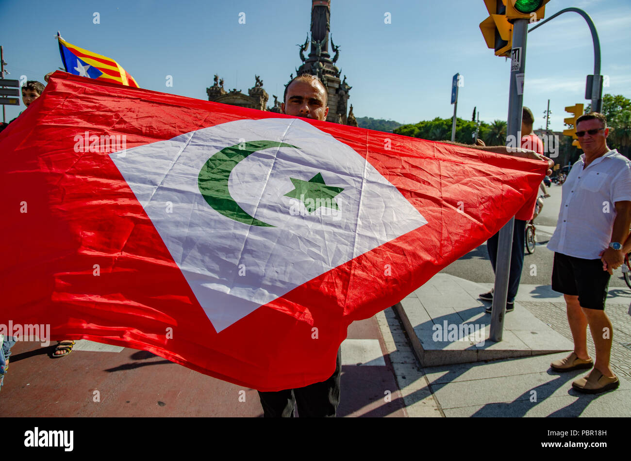 Barcelona, Catalonia, Spain. 29th July, 2018. A protester is seen ...