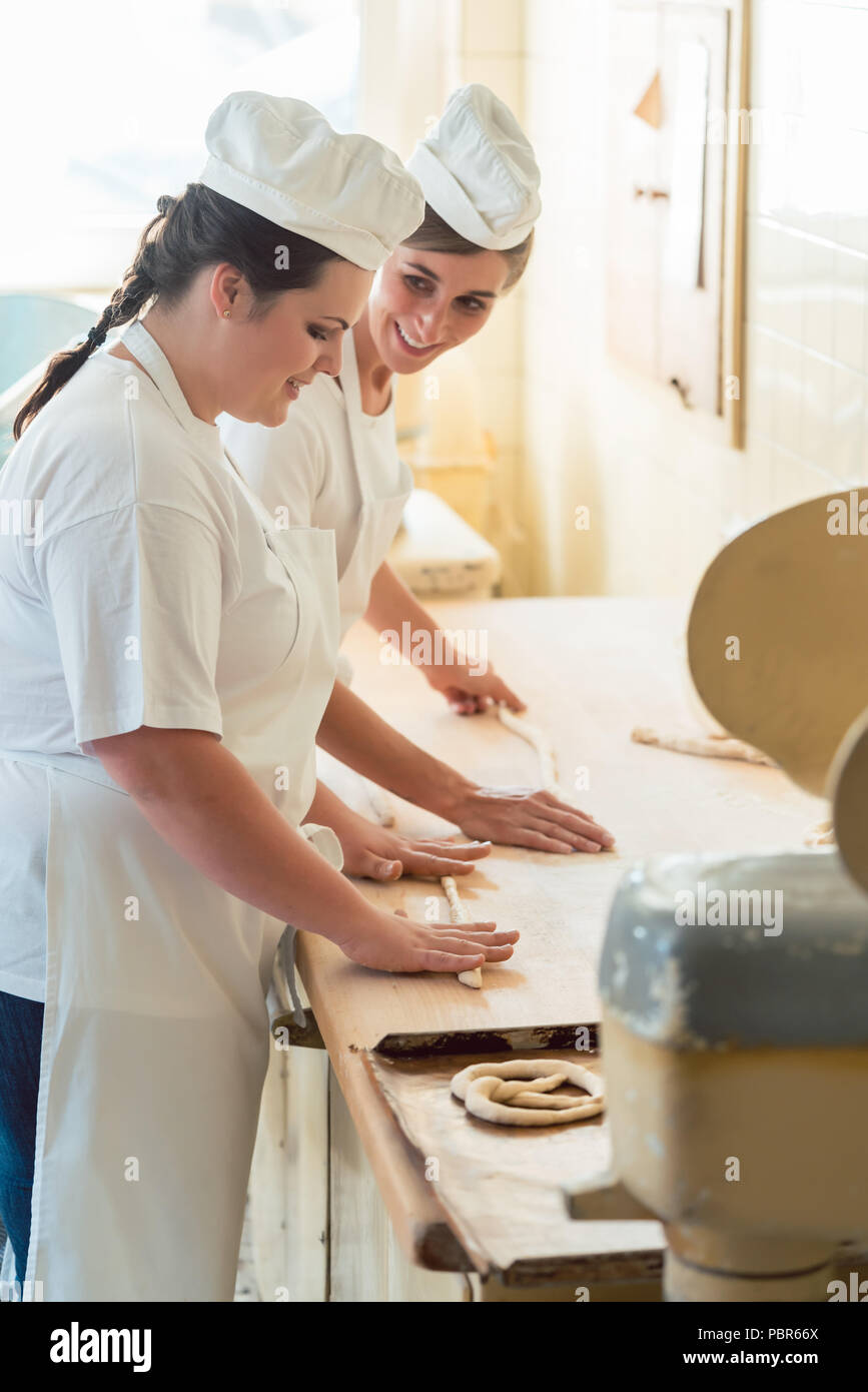Baker women working in bakehouse of bakery Stock Photo - Alamy