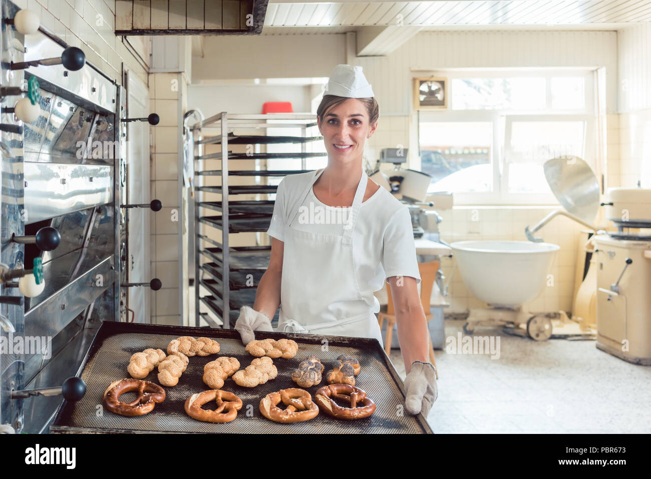 Female baker making bread hi-res stock photography and images - Alamy