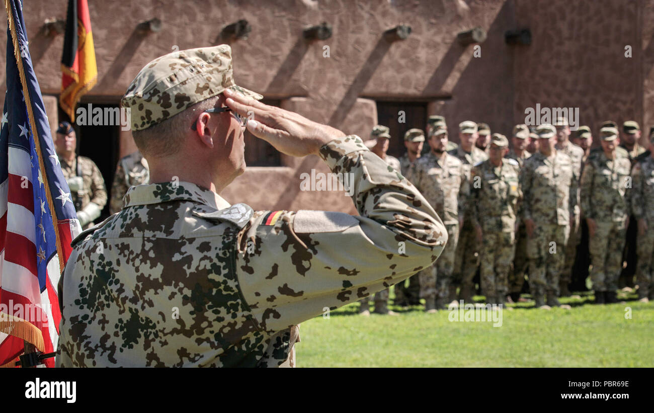 German Air Force Lt. Col. Ingo Scharschmidt returns his first salute as ...
