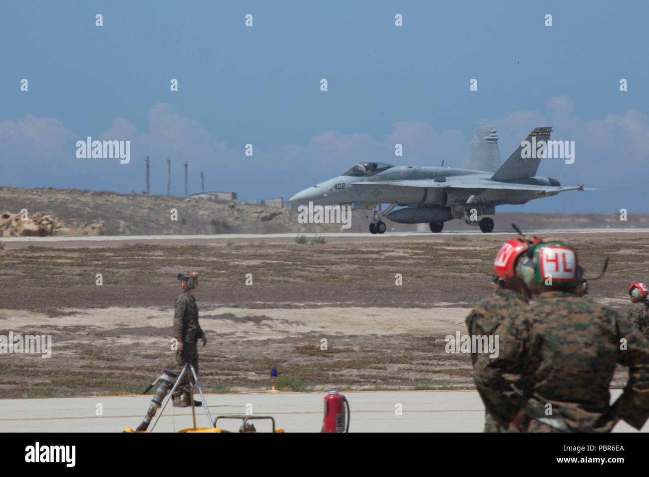An F/A-18C with Marine Wing Support Squadron (MWSS) 373 arrives down ...