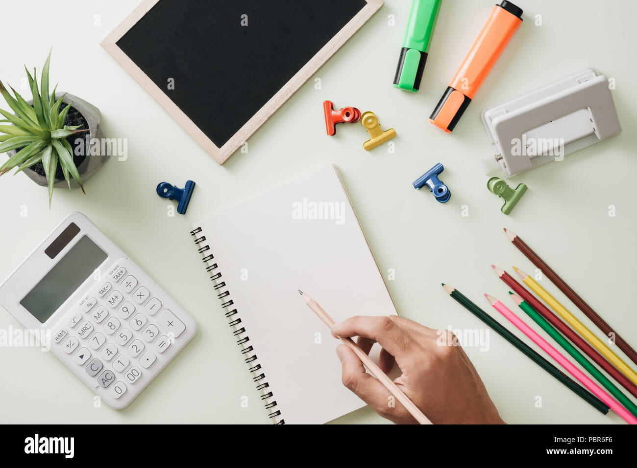 Office workplace - empty notepad, pen, pencil, ruler, compass on dark ...