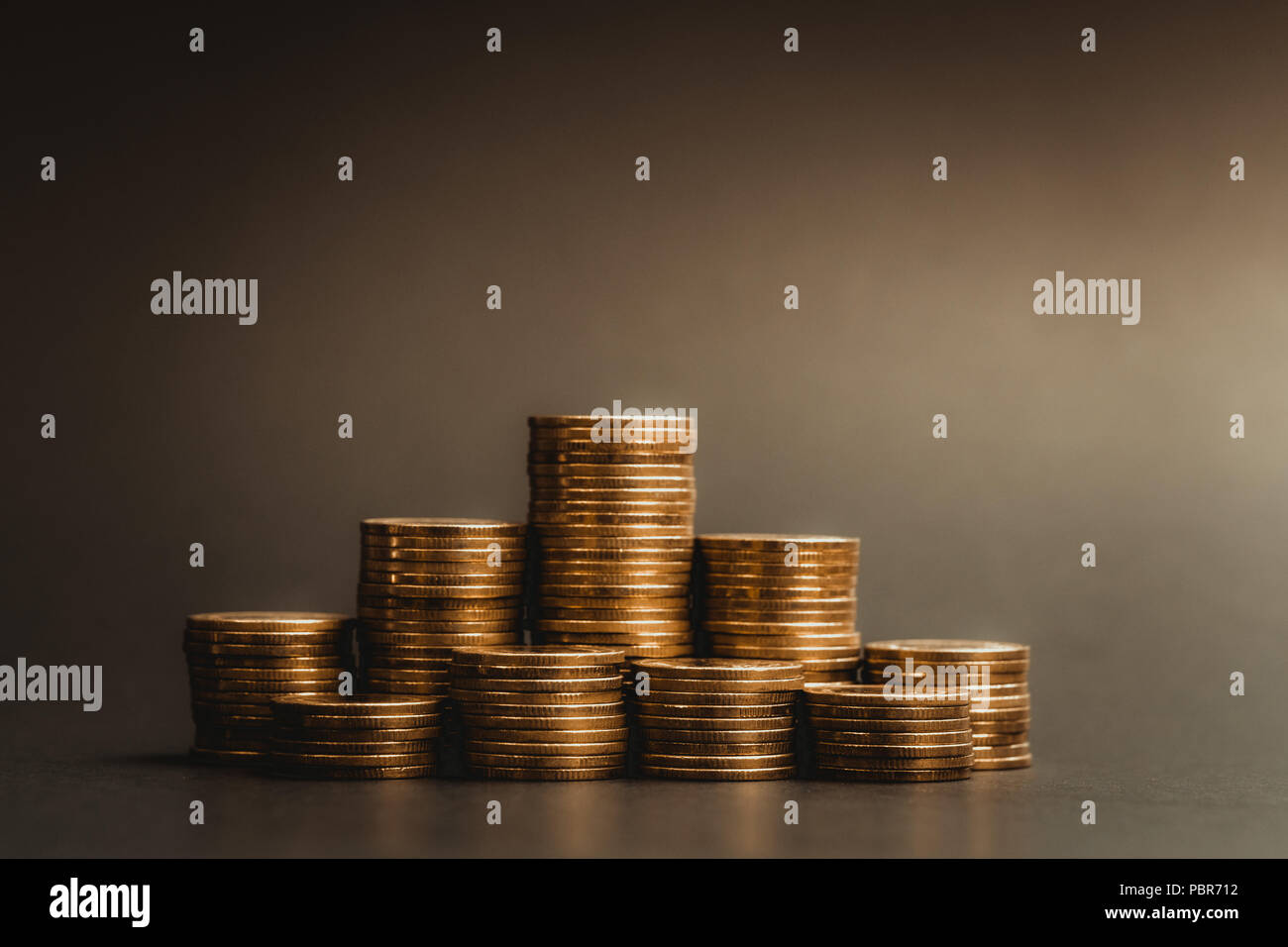 Savings, increasing columns of coins, piles of coins arranged as a ...