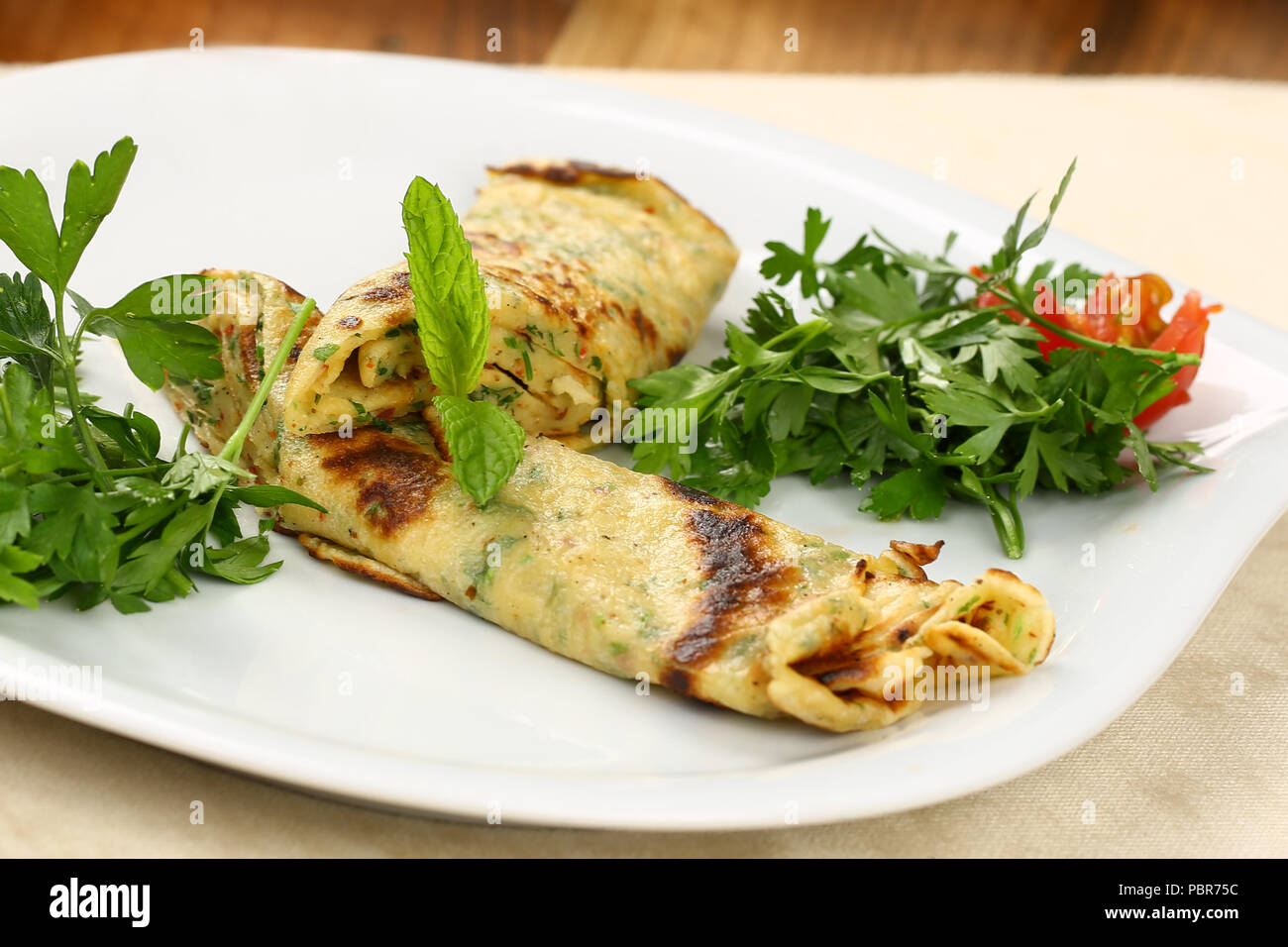 Crepe rolls filled with jam Stock Photo - Alamy