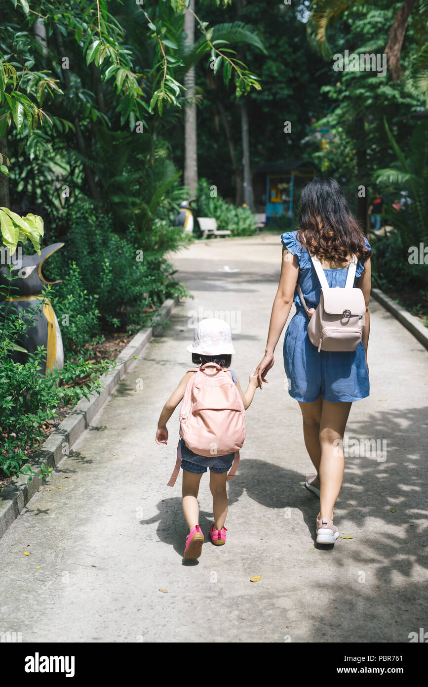 Happy family having fun with animals safari park on warm summer day ...